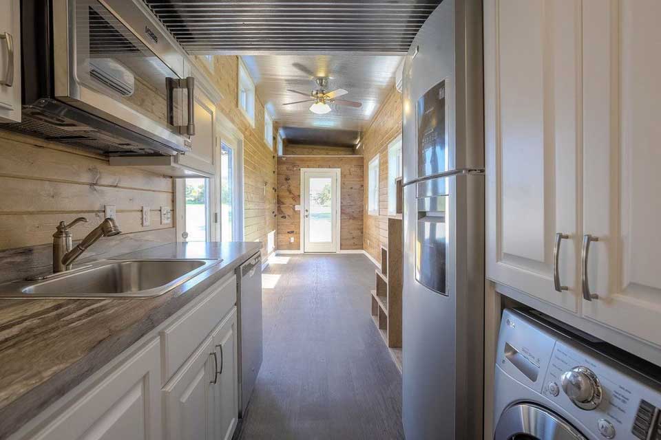 This Amazing Tiny Home With Porch Is Actually A 40-foot Shipping ...