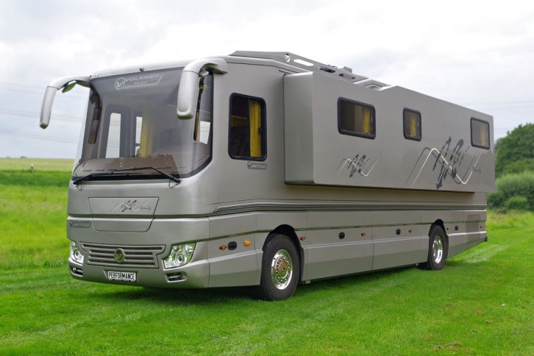 This Super Luxe Motorhome Has An Onboard Garage For A Sports Car