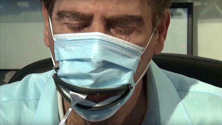 This Face Mask Is Split Horizontally And Hinged To Allow For Eating ...