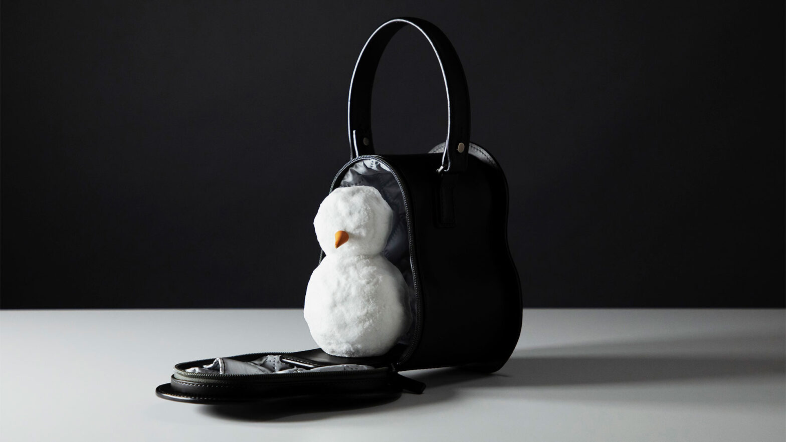 Here’s A Leather Bag Designed Specifically To Carry A Snowman